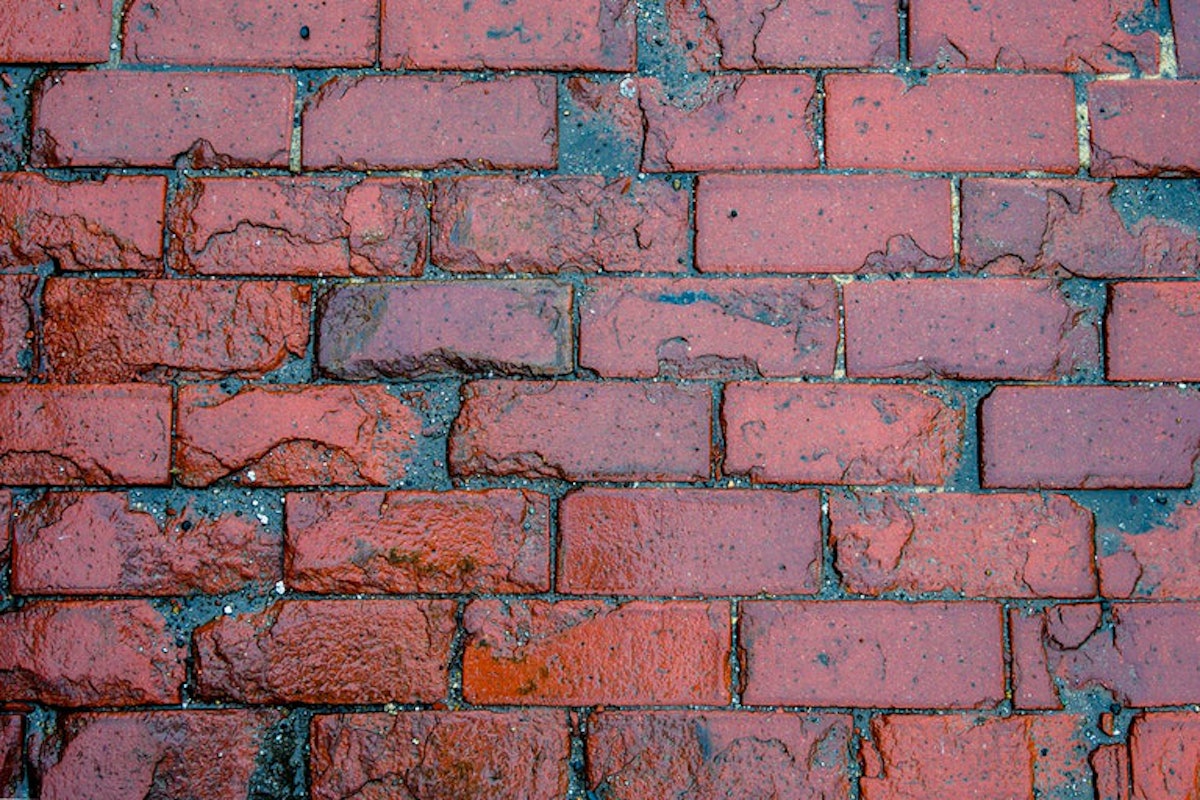 dented brick wall